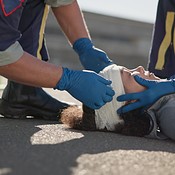 Paramedic team, woman and accident on street for brain injury ...
