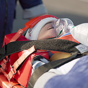 Paramedic, victim and stretcher with emergency service to save life ...