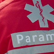 Paramedic man, walking and emergency on street with back, uniform and ...