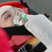 Accident, ambulance and patient with oxygen mask for injury, first aid ...