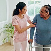 Rehabilitation, walking frame and physiotherapist with woman for ...