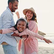 Parents, child and airplane play at beach for family connection, game ...