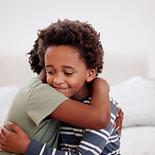 Children, brothers and hug for support in home bedroom, care and love ...