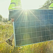 Teamwork, men carrying solar panel for installation in clean energy and ...