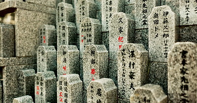 Stone monument in traditional Japanese graveyard with peace, calm and ...