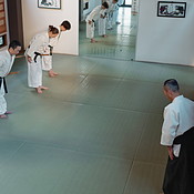 Asian man, sensei and bow in dojo class for respect, greeting or honor ...