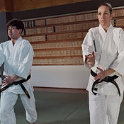 Students learning aikido, fitness and martial arts training class for ...