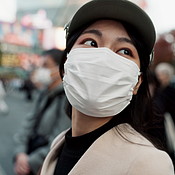 Japanese woman, face mask and busy city with walk, thinking and people ...