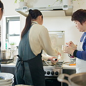 Talking, mother and teaching women cooking in the kitchen for food ...