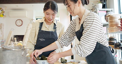 Cooking class, students and plating japanese food in kitchen, happiness ...