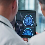 Back, tablet and screen, doctors and brain scan, discussion and collaboration with surgeon team ...