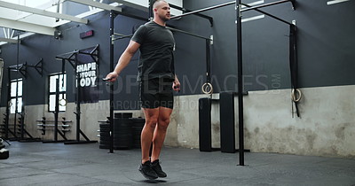 Fitness, power and man in gym skipping for health, wellness and body ...