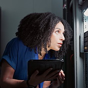 Check, engineer and woman on tablet in data center for cyber security ...