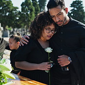Hug, support or couple in graveyard for funeral, spiritual service or ...