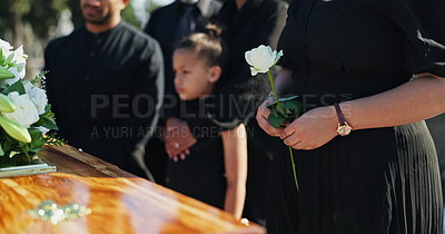 Funeral, man and woman hug at graveyard for memorial service at burial ...