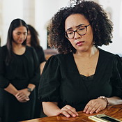 Coffin, funeral and sad woman with death, grief and people at burial ...