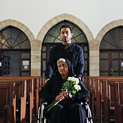 Senior woman, flowers and funeral at church with wheelchair, sad man ...