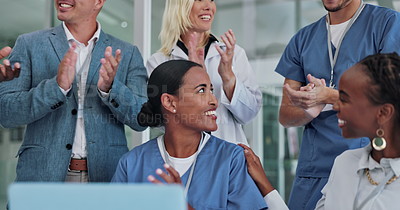 Doctor, meeting and applause for announcement, medical and hospital success with a reward at a ...