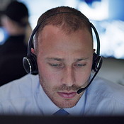 Emergency, call center and man on computer for service, first responder ...