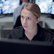 Computer, security and woman with surveillance on screen for protection ...