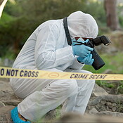 Forensic, photographer and police tape at crime scene for investigation ...