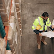 Distribution, paperwork and people in warehouse for stock inspection ...