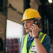 Industrial, factory and angry woman with phone call problem and stress ...