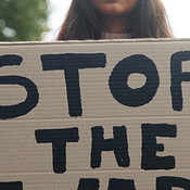 Protest, face and woman with cardboard sign for rally to stop war ...