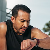 Man, exercise and check watch outdoor for stats on cardio, training or ...