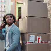 Delivery man, mistake and boxes or package with chaos, confused and ...