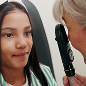 Girl, optometrist and checkup for vision, health and eye care with ...