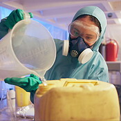 Research, ppe and person with liquid in lab for experiment, chemistry ...
