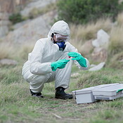 Outdoor, scientist and test in environment, uniform and safety with ...