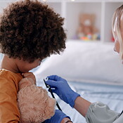 Doctor, boy and stethoscope with listening in hospital for examination ...