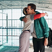 Friends, greeting and hug for hello, happy reunion or meeting at ...