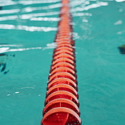 Closeup, race lines and swimming pool for fitness in professional, gym ...