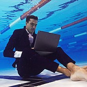 Business, man and working on laptop in pool, typing and drowning in ...