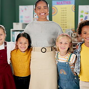 Face, students and happy teacher at kindergarten in classroom, bonding ...