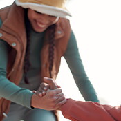 Hiking, friends and helping hand in forest for support, climbing and ...