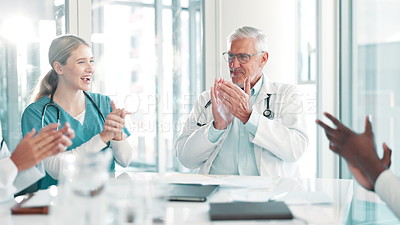 Applause, teamwork and doctors in hospital to celebrate success, collaboration and winning ...