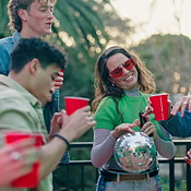 Group, friends and party with celebration, beer and event with concert ...