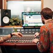 Men, partners and music producer in recording studio for sound or audio ...