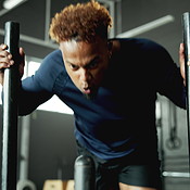 Prowler sled, fitness and man in gym, wellness and power with exercise ...