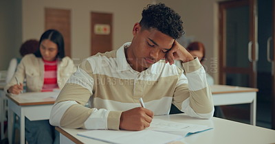 High school, depression and tired boy in classroom with test anxiety ...