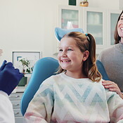 Healthcare, pediatric dentist and girl with demonstration, oral ...