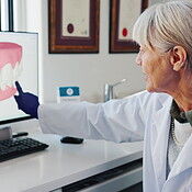 Woman, dentist and computer screen with mouth for dental demonstration ...