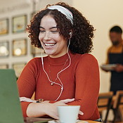 Video call, laptop and girl laughing in cafe for remote work ...