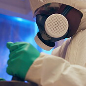 Person, mixing and grinding powder in lab for methamphetamine, chemical ...