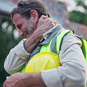 Neck pain, construction worker and injury on site, spine and strain ...