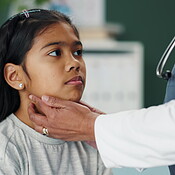 Nurse, patient and hands on neck to check for tonsils, thyroid disease ...